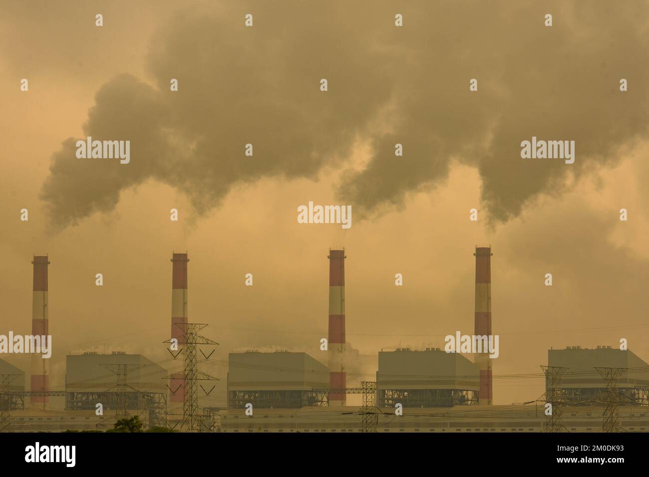 Cropped shot of coal power plant with steam pouring out of the stack ...