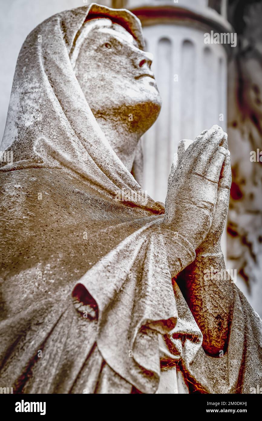 Faithfull Virgin Mary with praying hands and blessing, looking at the ...