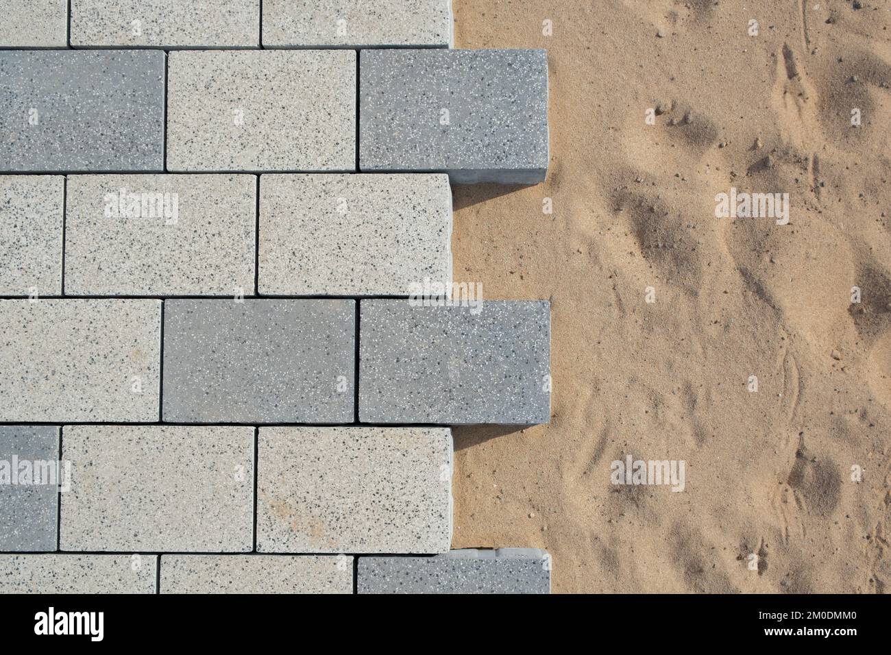Street construction site, laying tile blocks and stone blocks on ...