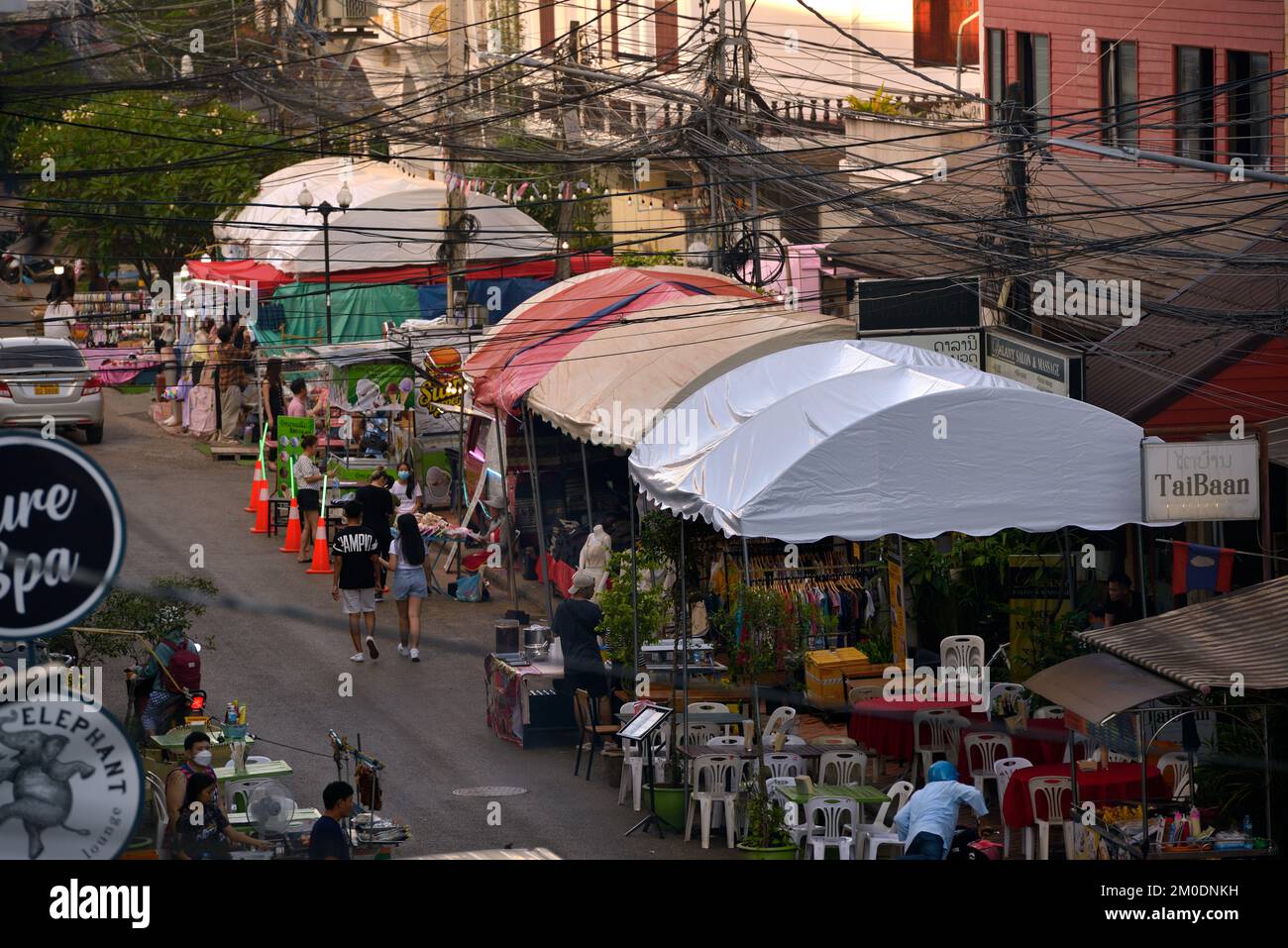 Tourists and locals mingle in the popular night market on a Friday in ...