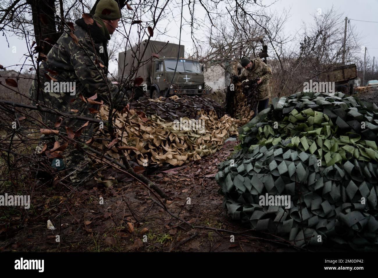 Terny, Ukraine. 27th Nov, 2022. Two soldiers are seen covering multiple ...