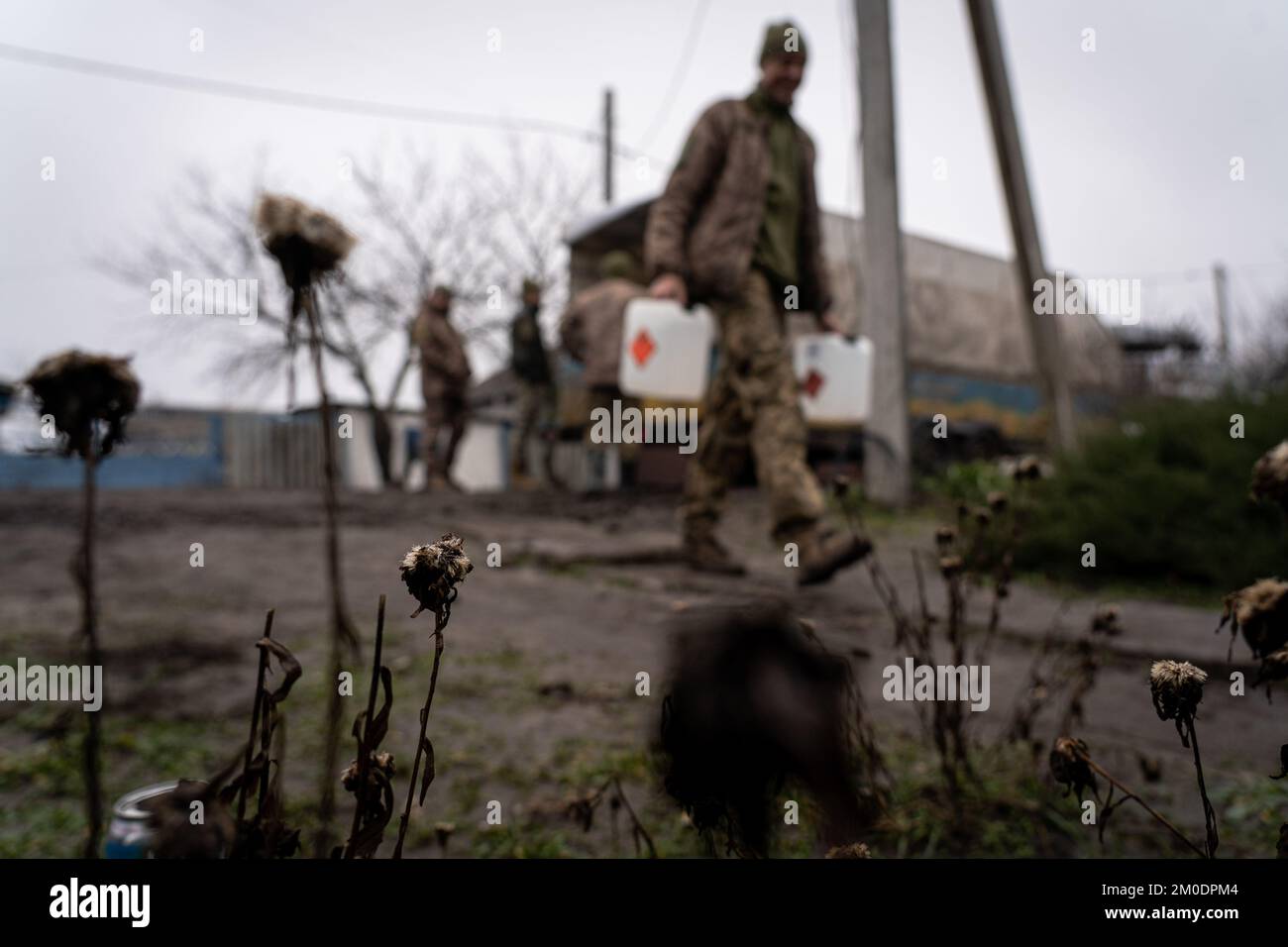A soldier is seen carrying medical supplies from a delivery. The ...