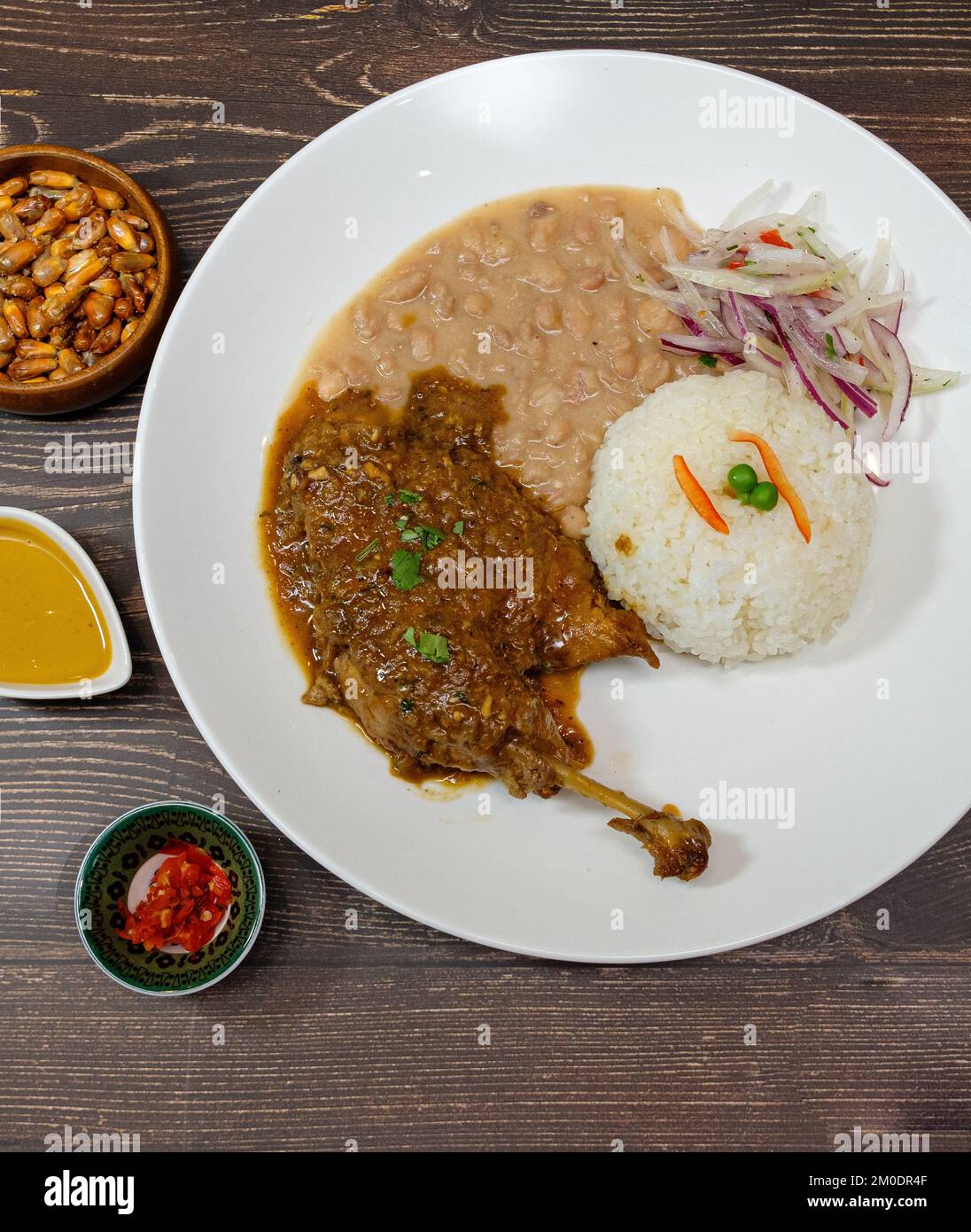 white beans with chicken and beef, served with rice and red onion ...