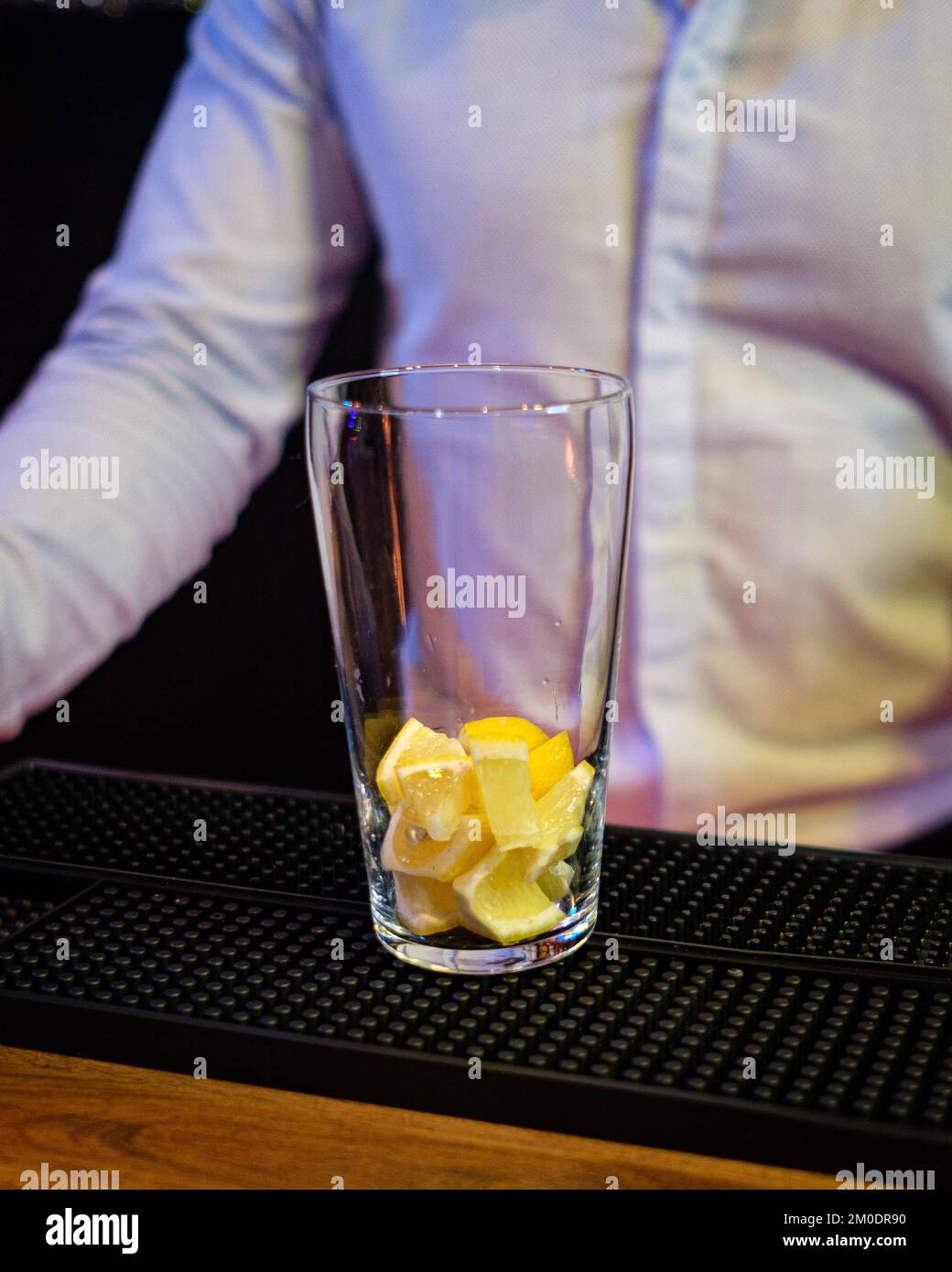 preparation of a cocktail based on lemon and pisco liqueur Stock Photo ...