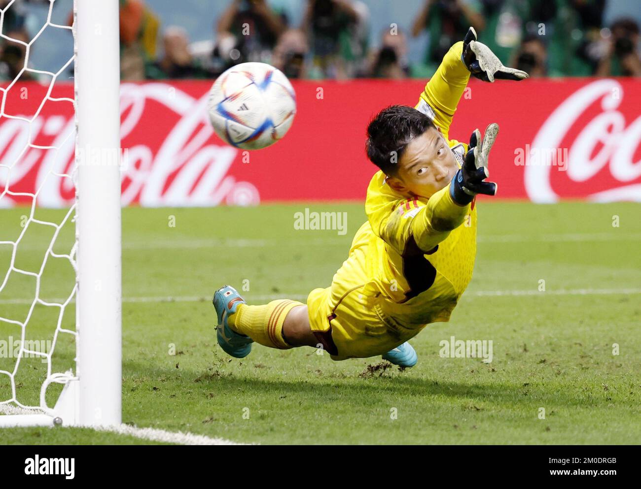 Japan goalkeeper Shuichi Gonda saves from Marko Livaja during a penalty ...