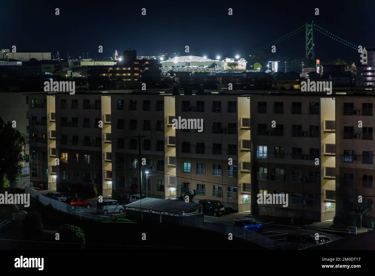 Low occupancy five story apartment buildings at night Stock Photo - Alamy