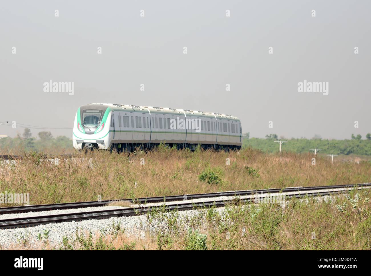 Abuja, Nigeria. 5th Dec, 2022. A train moves on the rail track near a ...