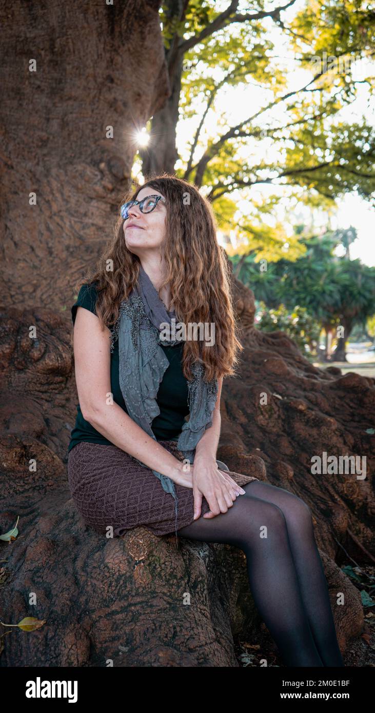 Woman curly hair green scarf hi-res stock photography and images - Alamy