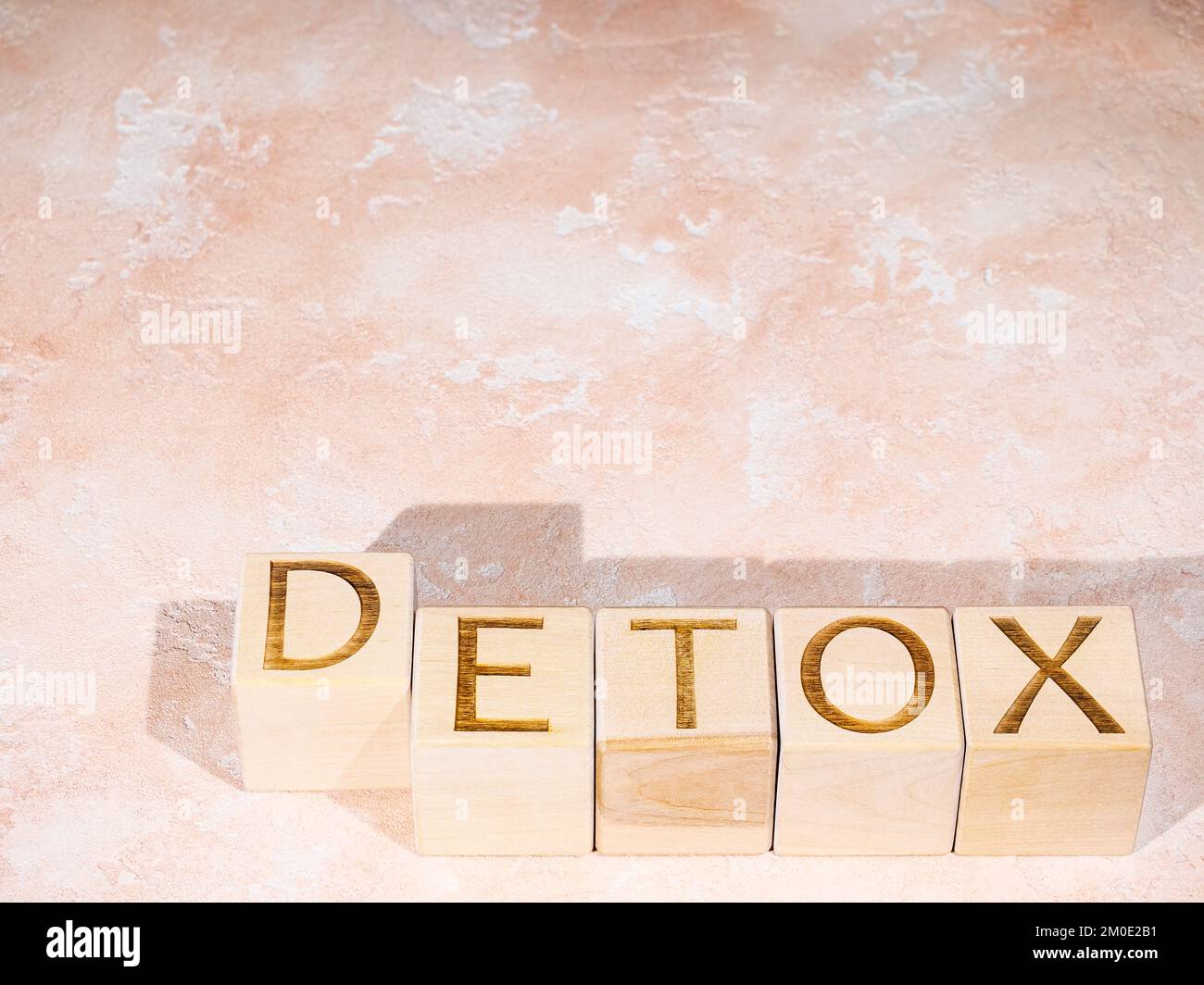 DETOX text on wooden blocks on a light orange background Stock Photo ...