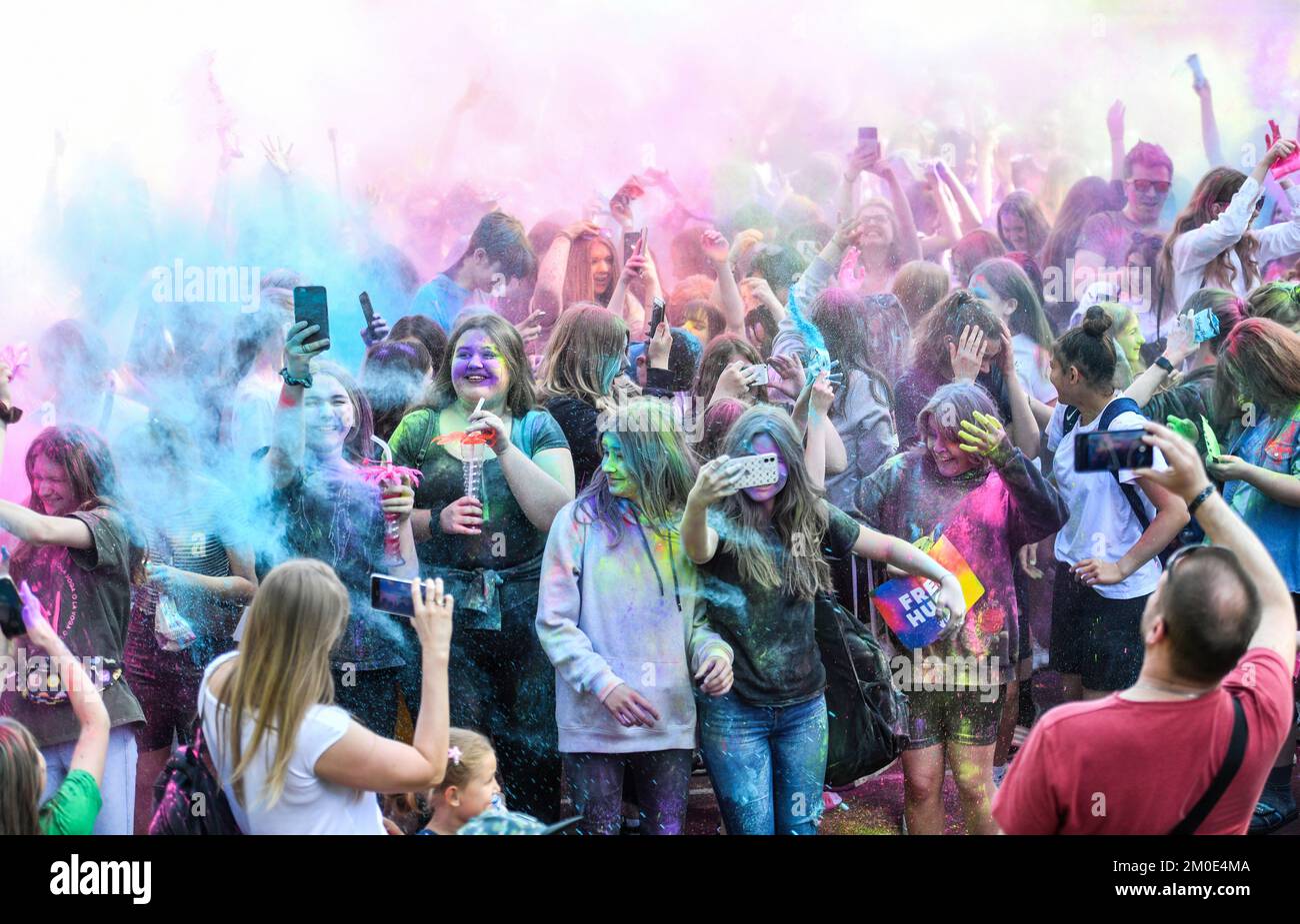 People seen throwing colorful powders at each other during the Holi ...