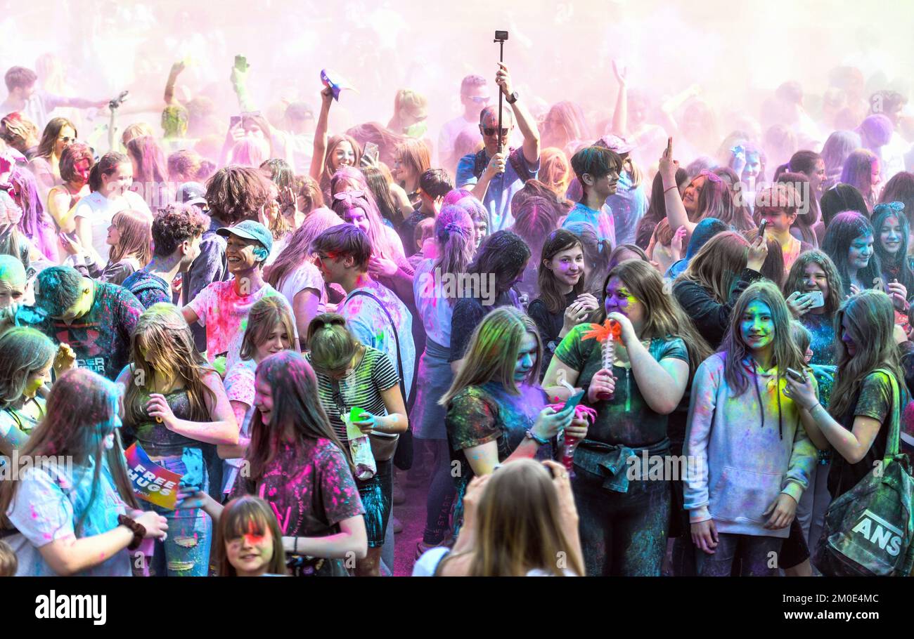 People seen throwing colorful powders at each other during the Holi ...