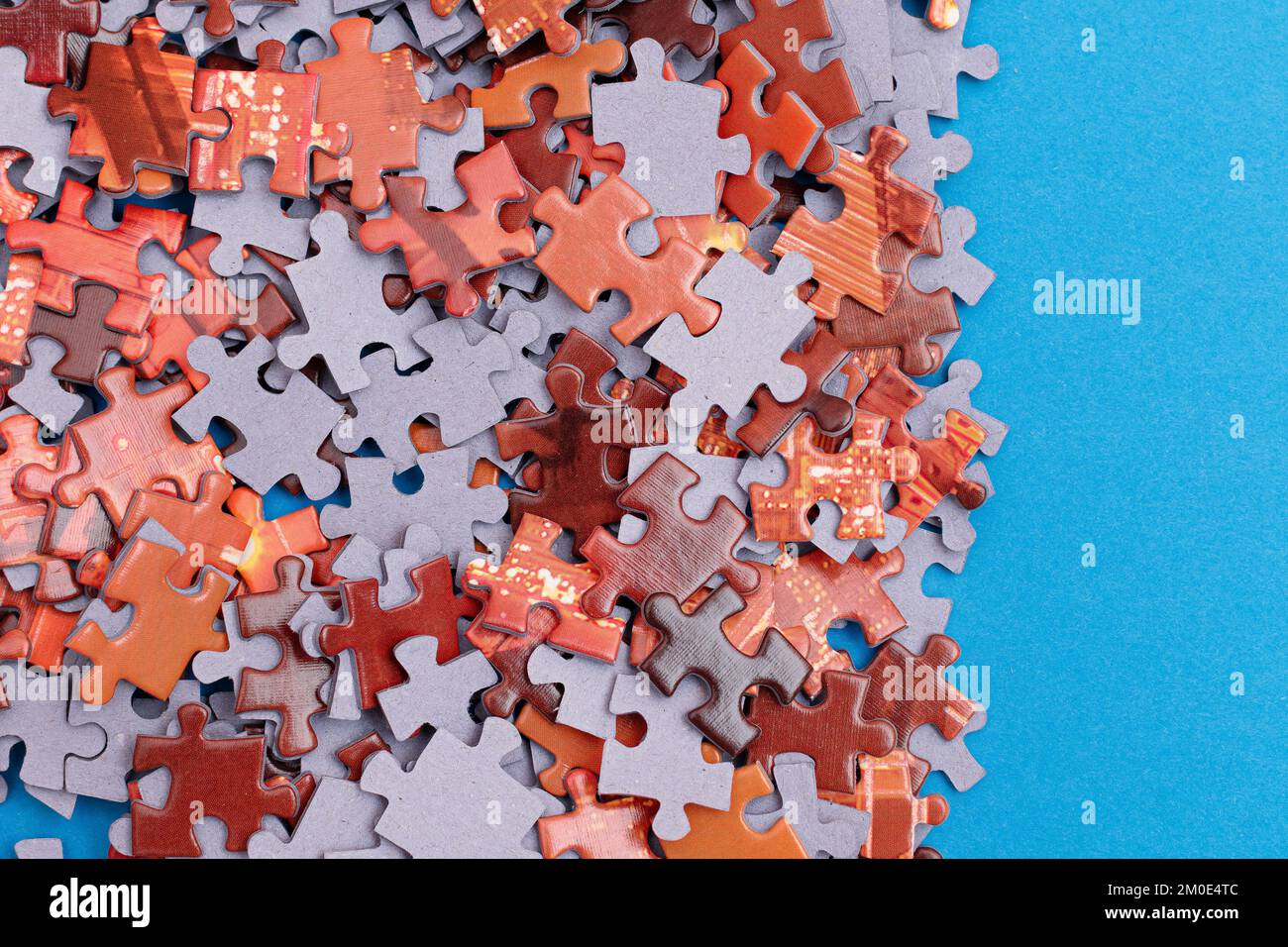 Mixed Peaces of a Colorful Jigsaw Puzzle Lie on the Blue Background ...