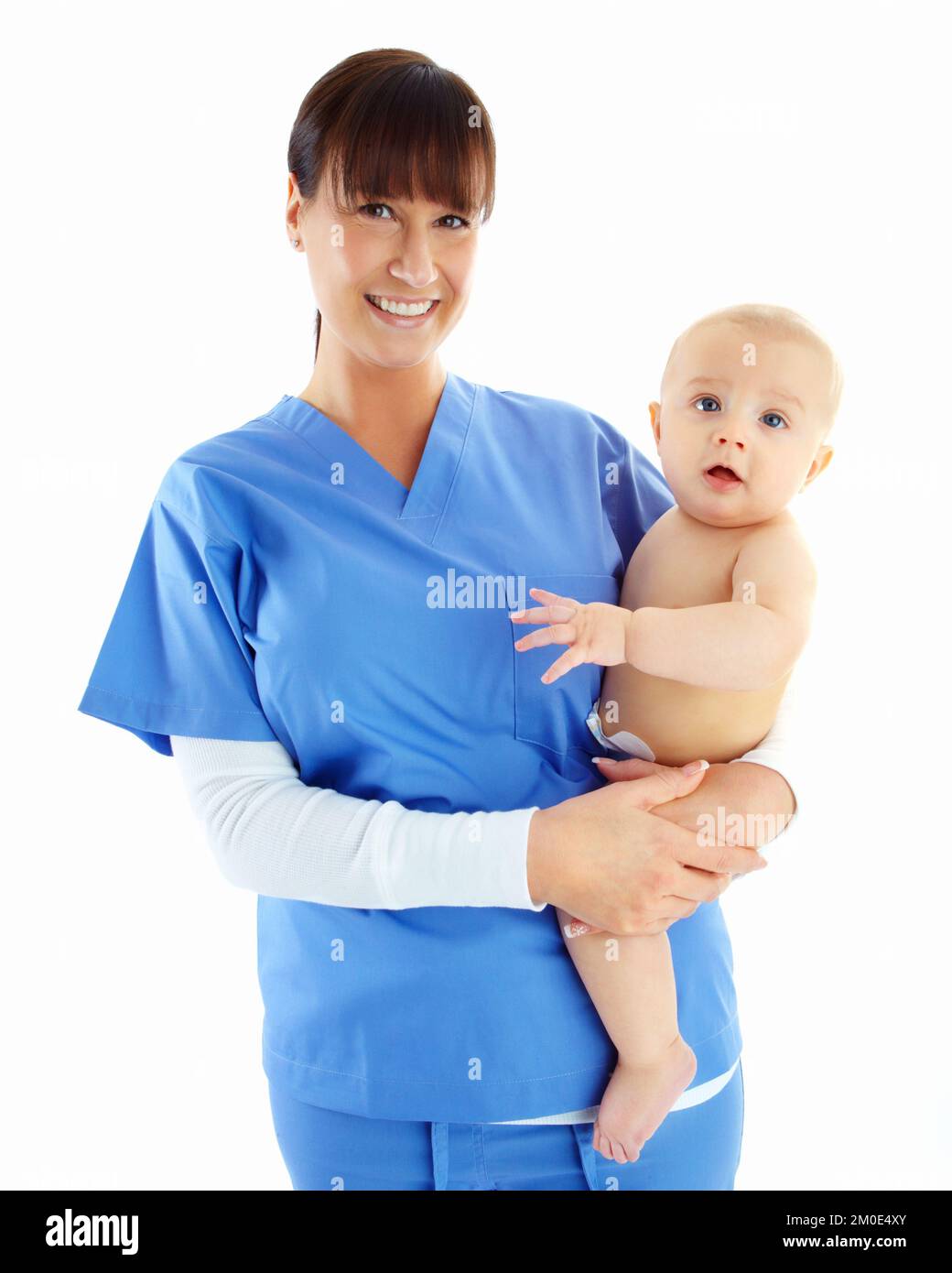 Caring for your baby. Smiling pediatrician holding a cute baby boy ...