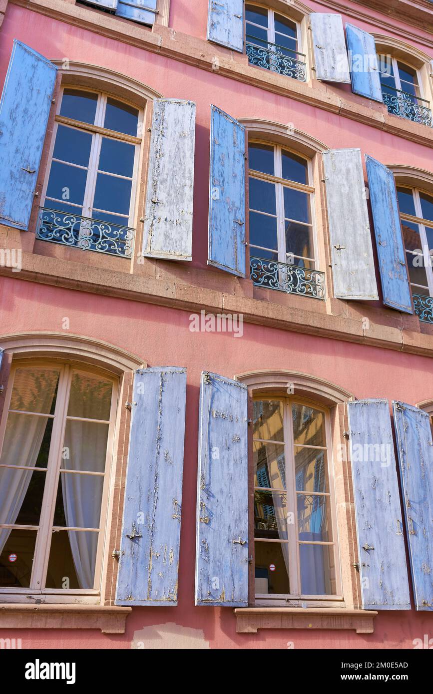 Windows with shutters on the facade of a house in the historic center ...