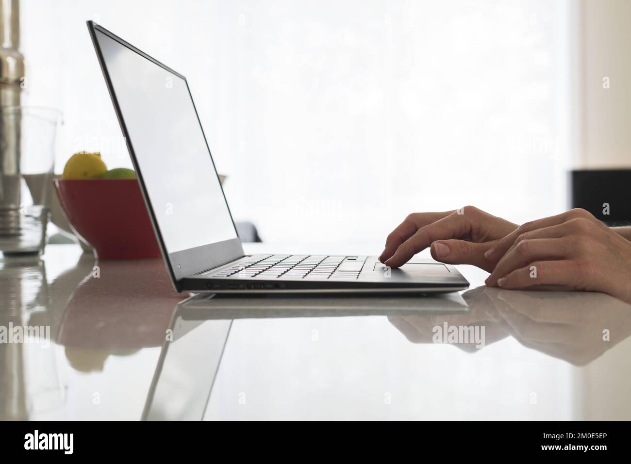 Close up of female hand scrolling on mouse pad of modern laptop ...