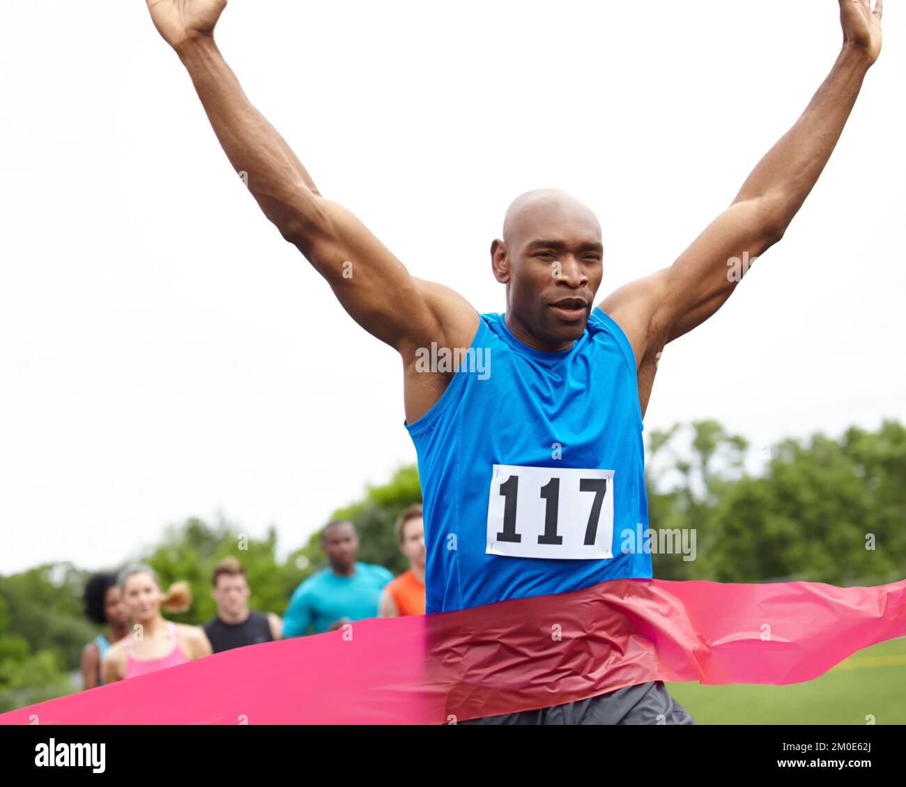 His dedication pays off. a winning athlete at the end of a race Stock ...
