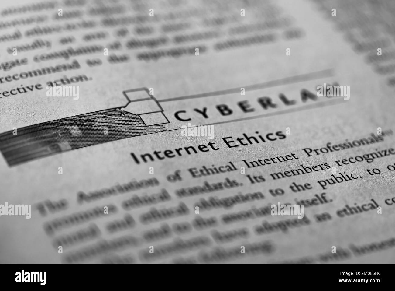 A closeup of a legal textbook with a chapter about internet ethics and ...