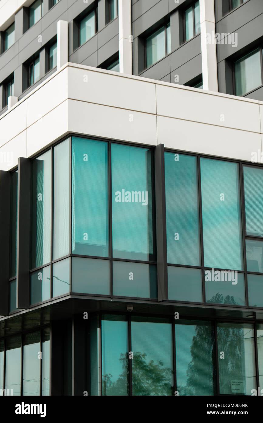 Modern office building exterior with glass facade on clear sky ...