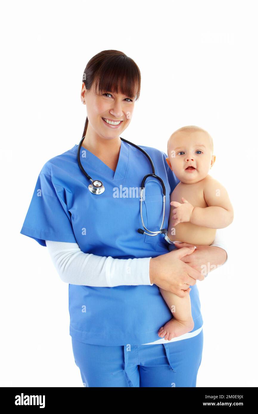 Dedicated to pediatric care. Smiling pediatrician holding a cute baby ...