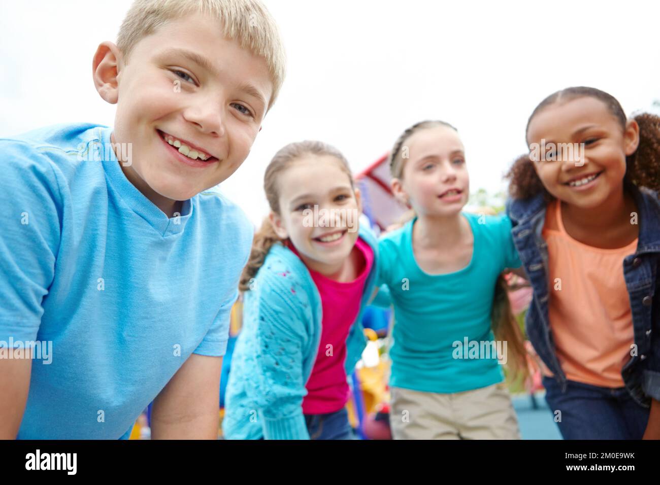 Enjoying spending time with friends. A group of kids standing on the ...