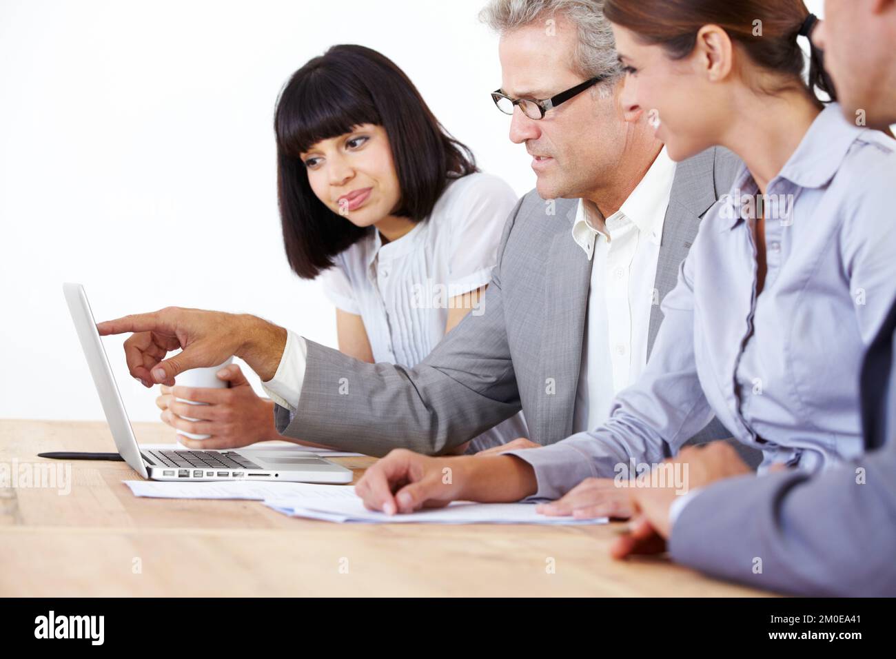 Creative business minds strategize. Four enterprising executives ...