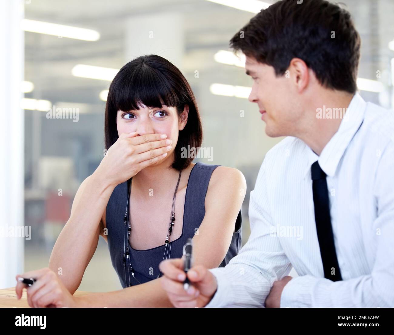 Work is play whenever hes around. A businesswoman laughing at her ...