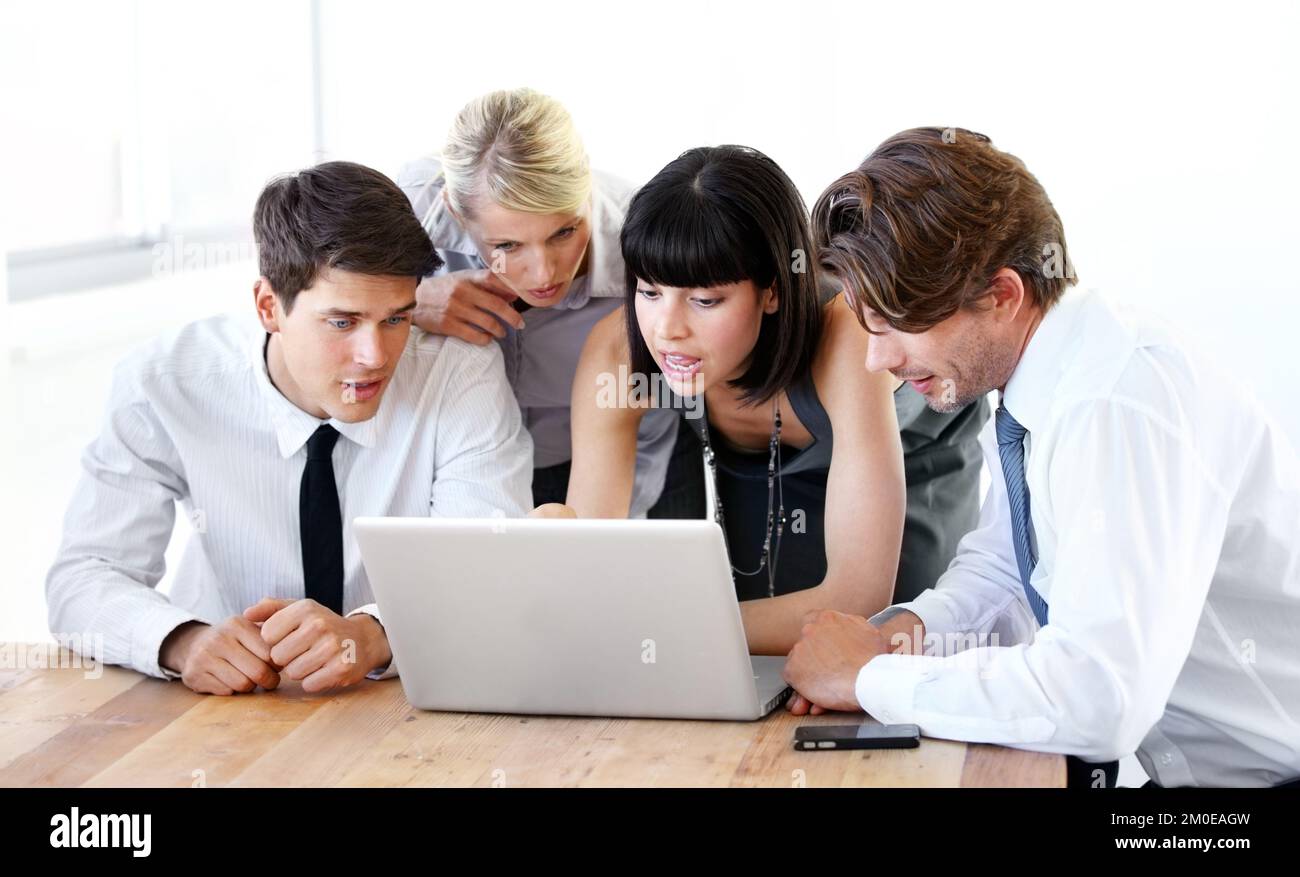 Achieving success through teamwork. Group of businesspeople working ...