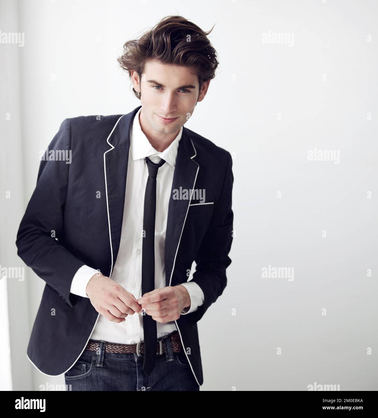 Confident in his sense of style. A young man looking very confident in ...