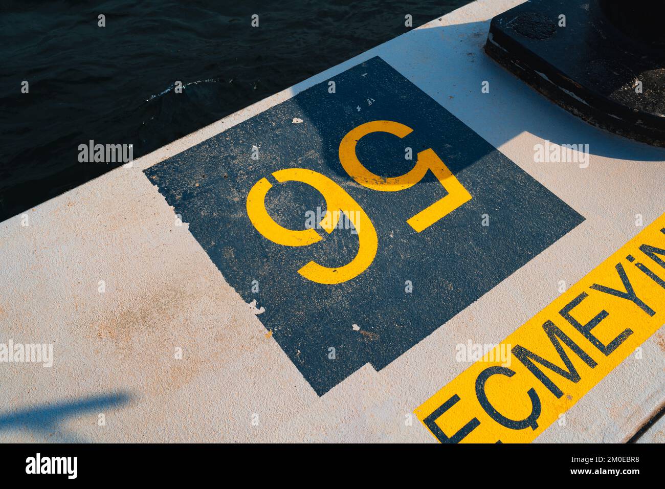 Concrete pier with yellow designations close up Stock Photo - Alamy