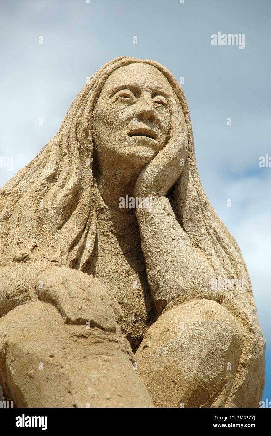 Sand sculpture of a sad woman Stock Photo - Alamy