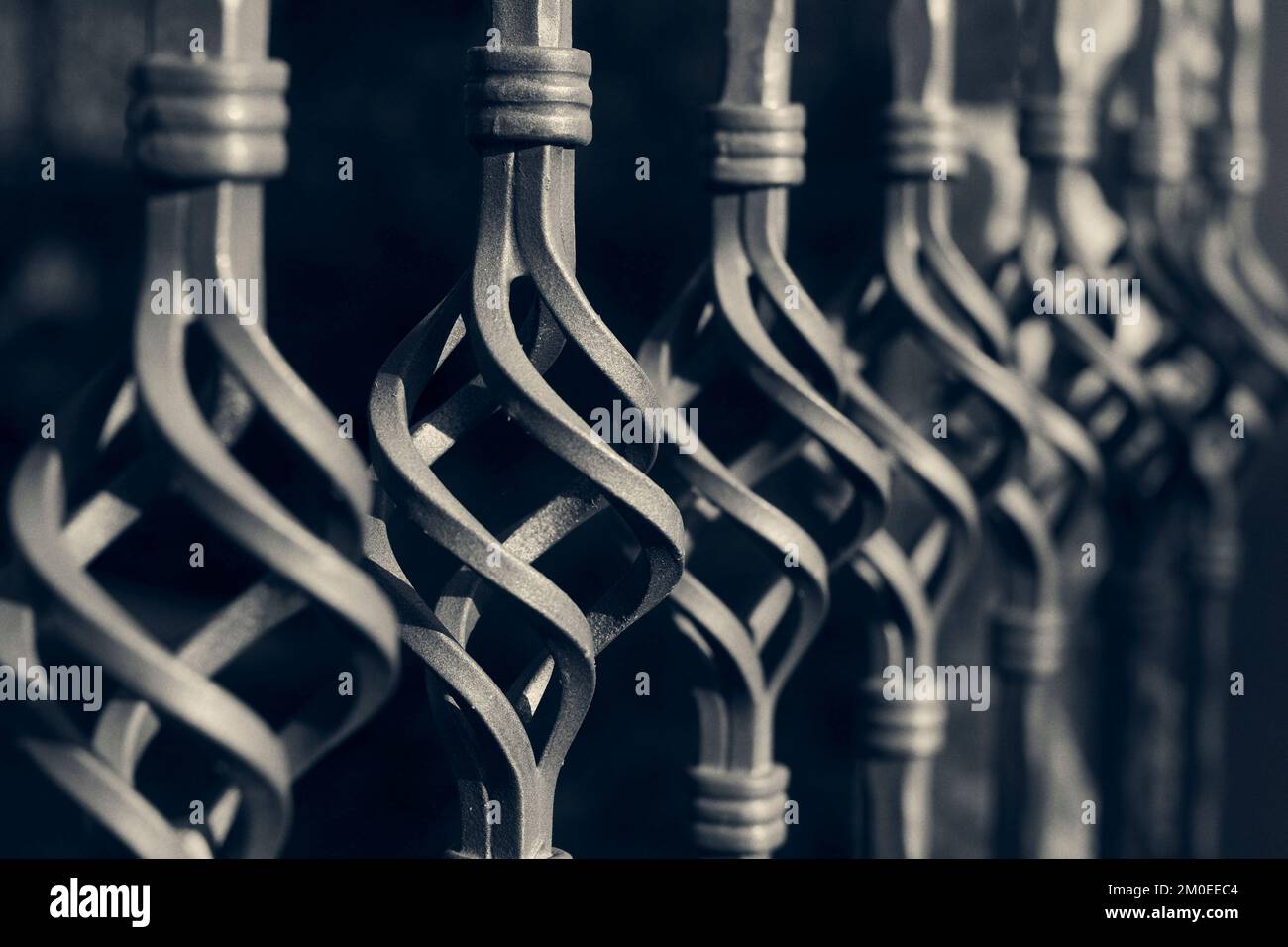 Black wrought iron front garden. Metal fence made of forged steel ...