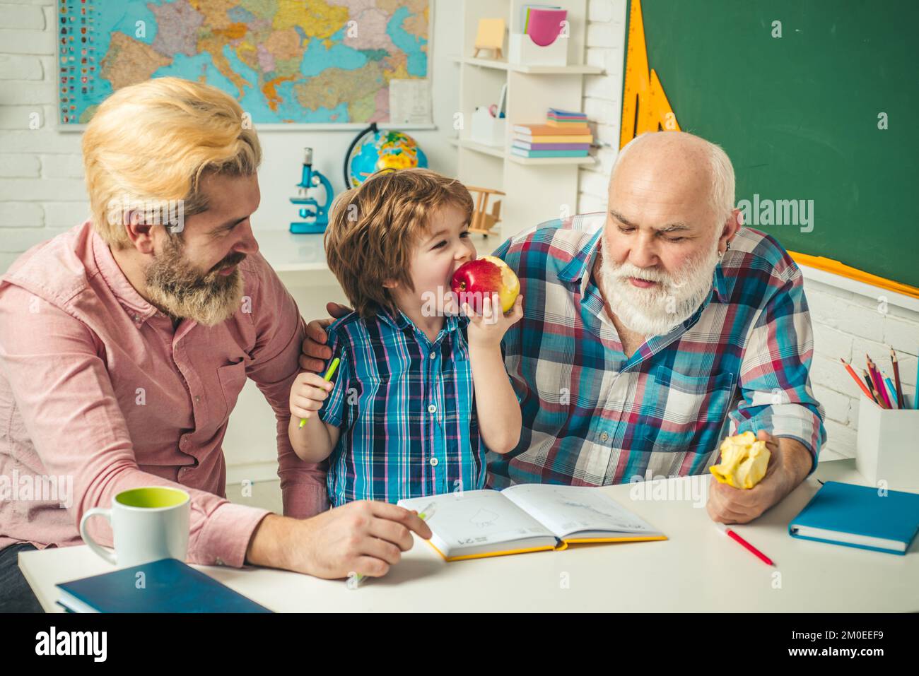 Grandfather and father teaching son. Granddad and cute little boy ...