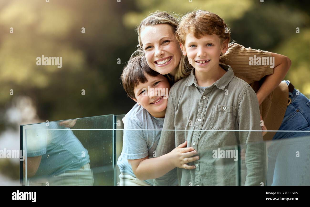 Portrait of a happy caucasian family of three enjoying the view from a ...
