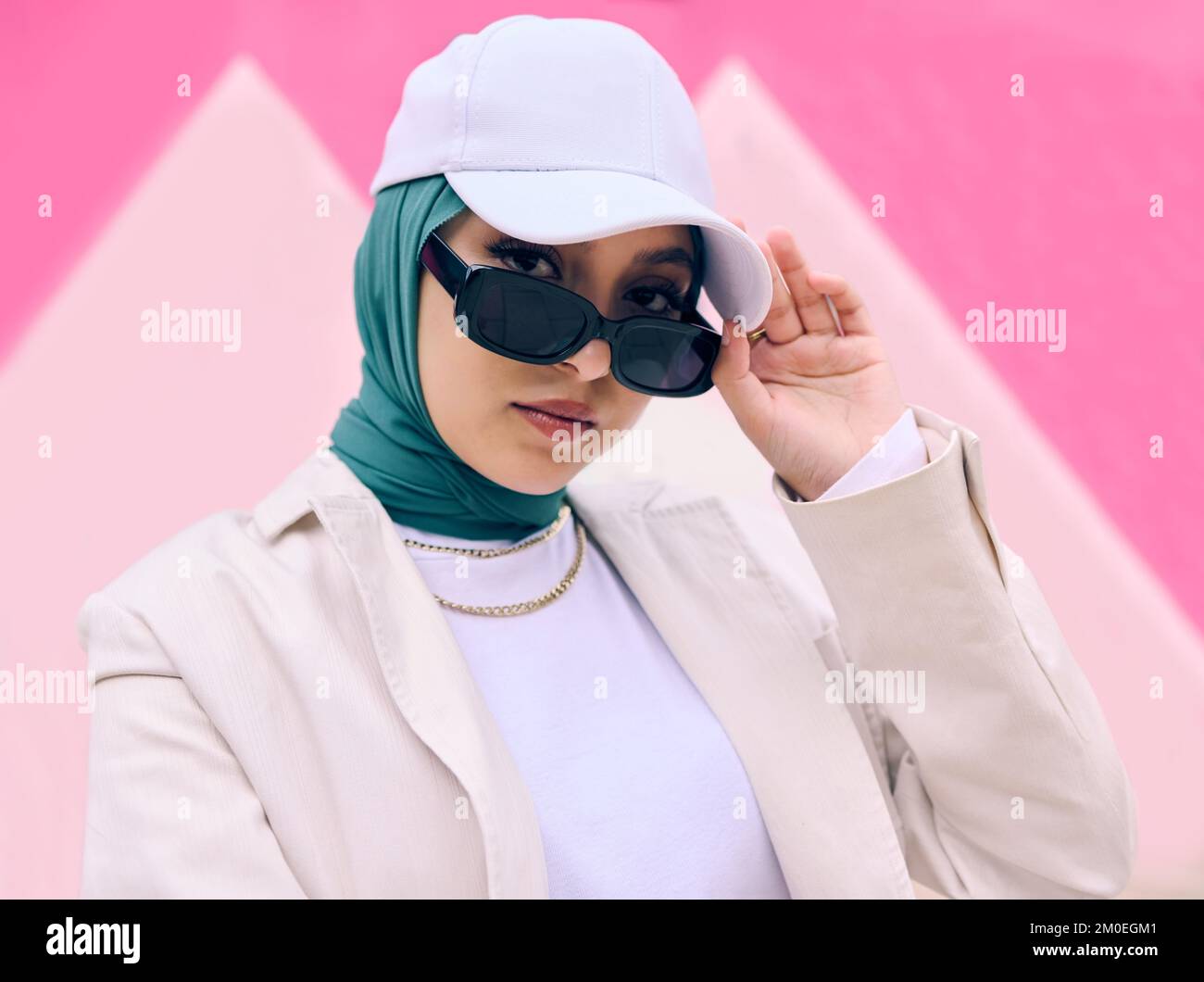 Beautiful young arab woman posing outdoors in a headscarf. Attractive ...