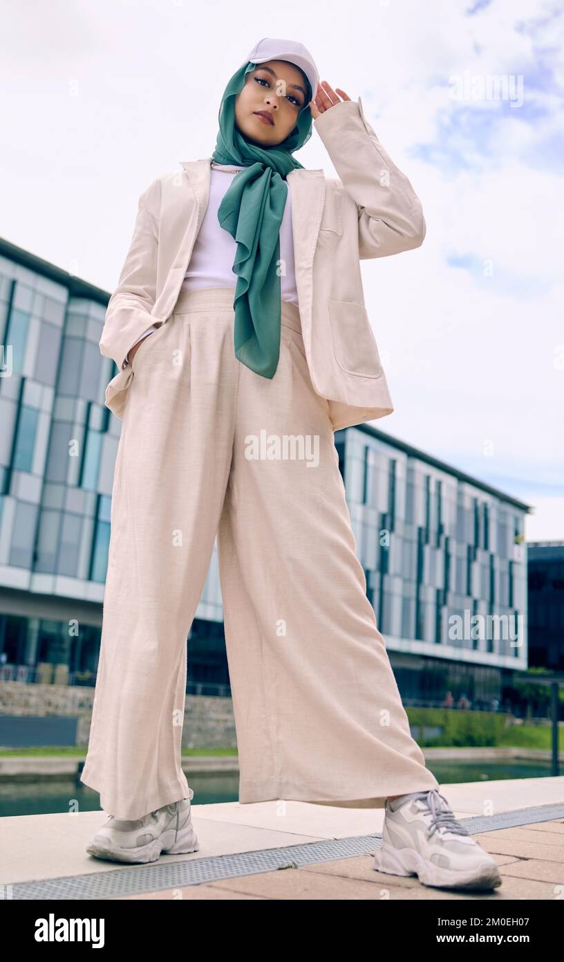 Beautiful young arab woman posing outdoors in a headscarf. Attractive ...