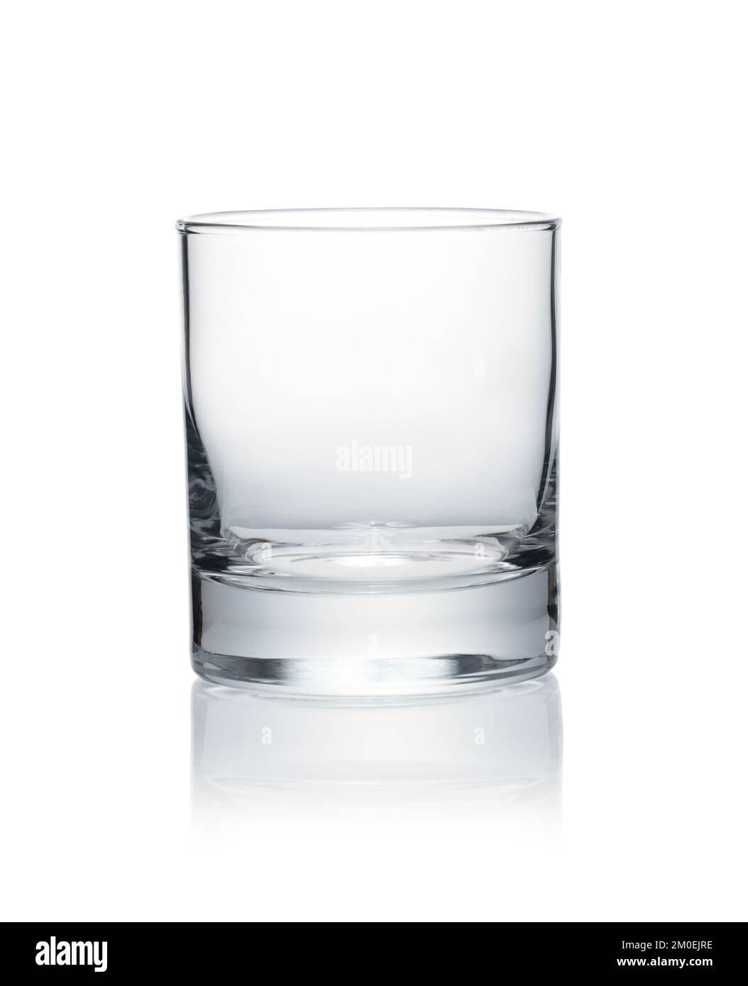 Empty whiskey glass on white background Stock Photo - Alamy