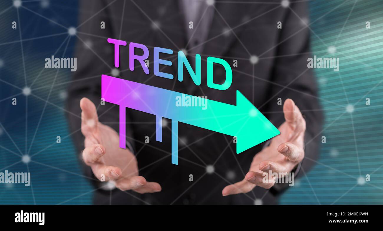 Trends concept above the hands of a man in background Stock Photo - Alamy