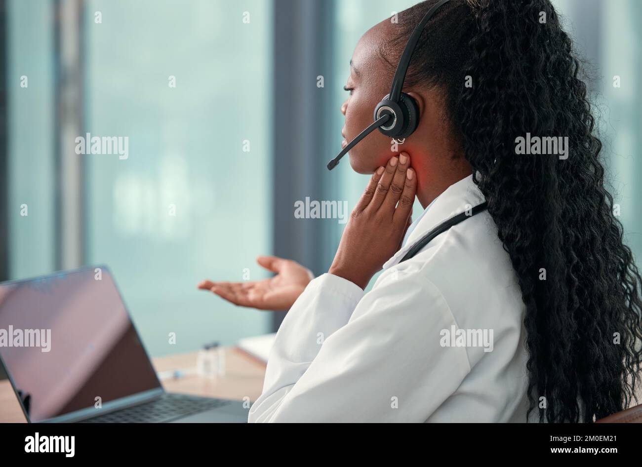 Medical call center worker with a sore throat. African american doctor ...