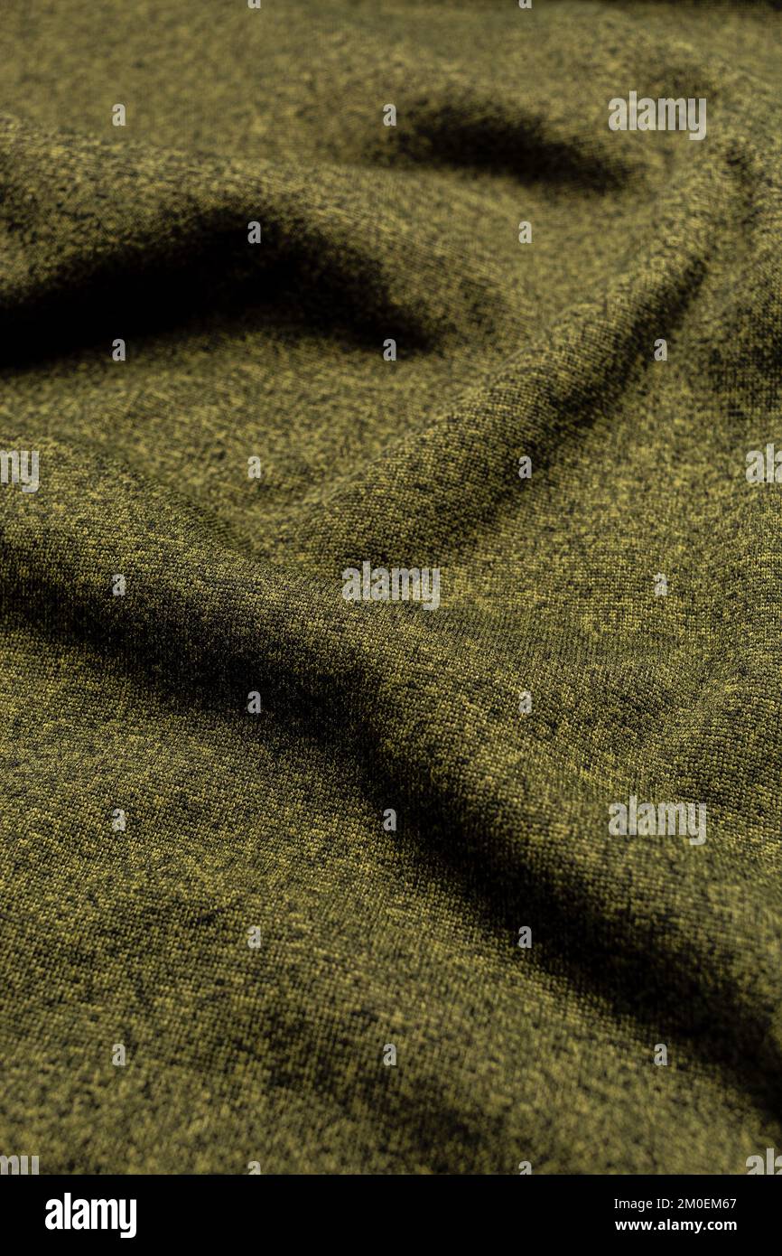 Closeup texture of knitted fabric in green color. Light khaki ...