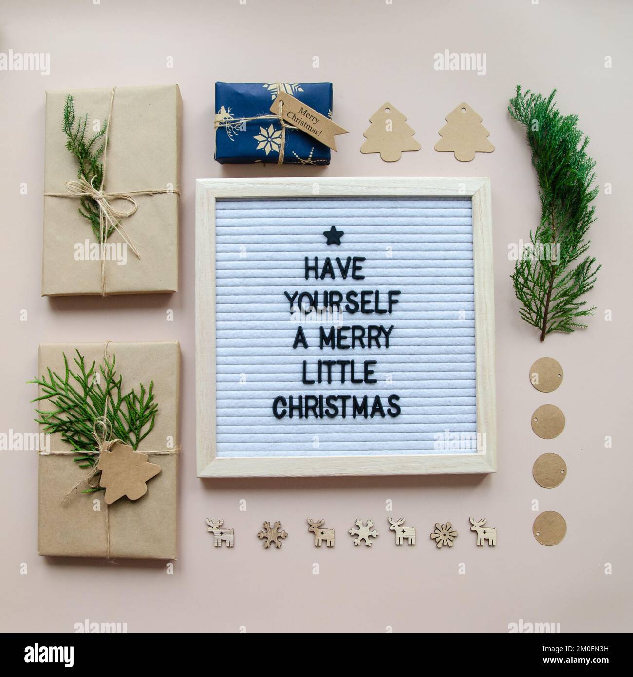 Christmas flatlay letter board spelling Have yourself a merry little ...
