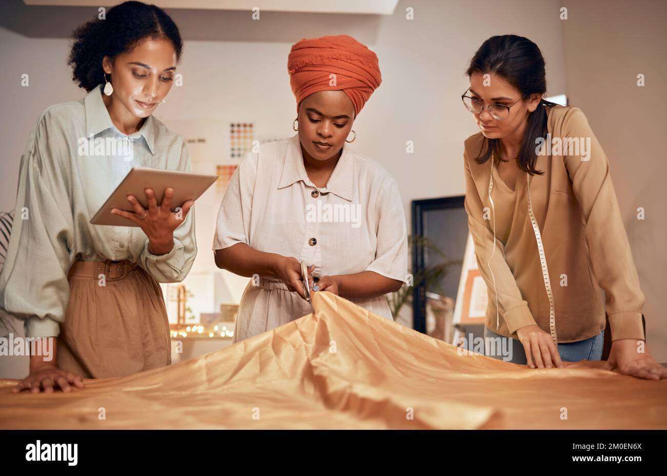 Creative woman, fashion design and tablet in teamwork for clothing ...