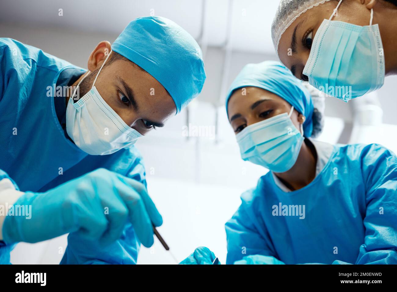 Surgery, team and hospital with surgeon support from medical staff in ...