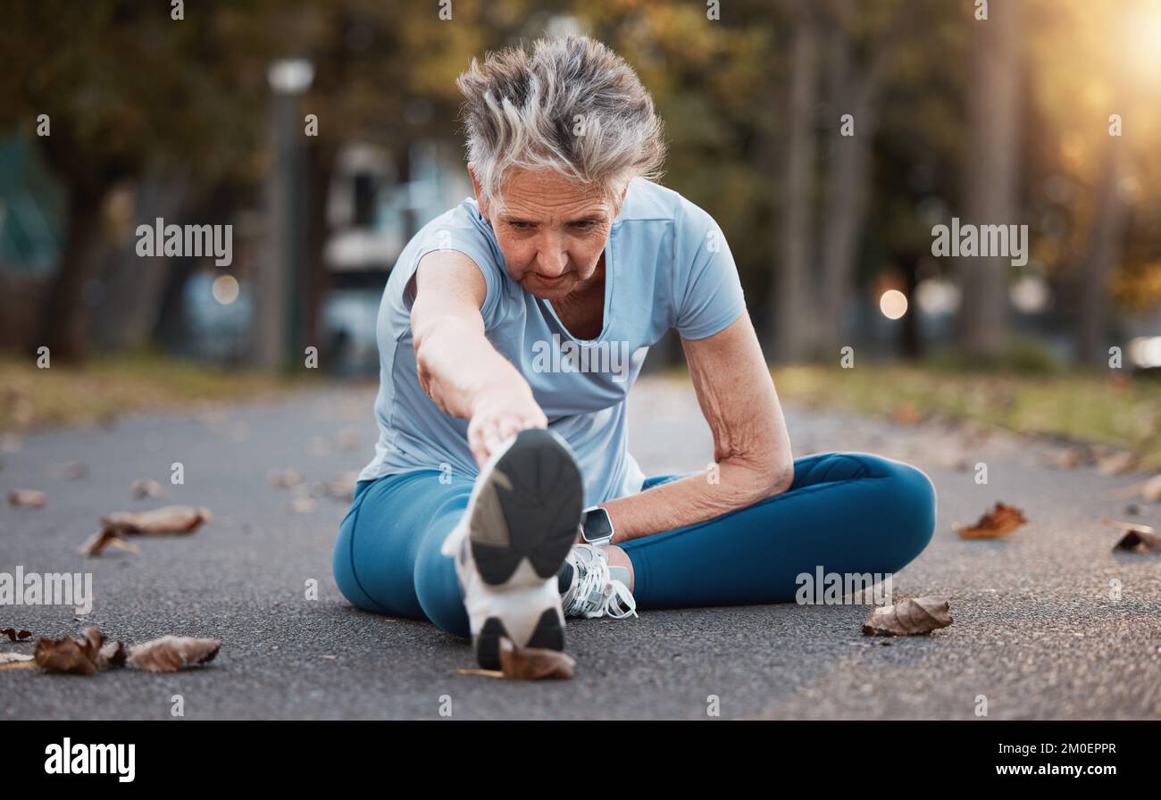 Senior woman runner, street and stretching for healthy exercise, urban ...