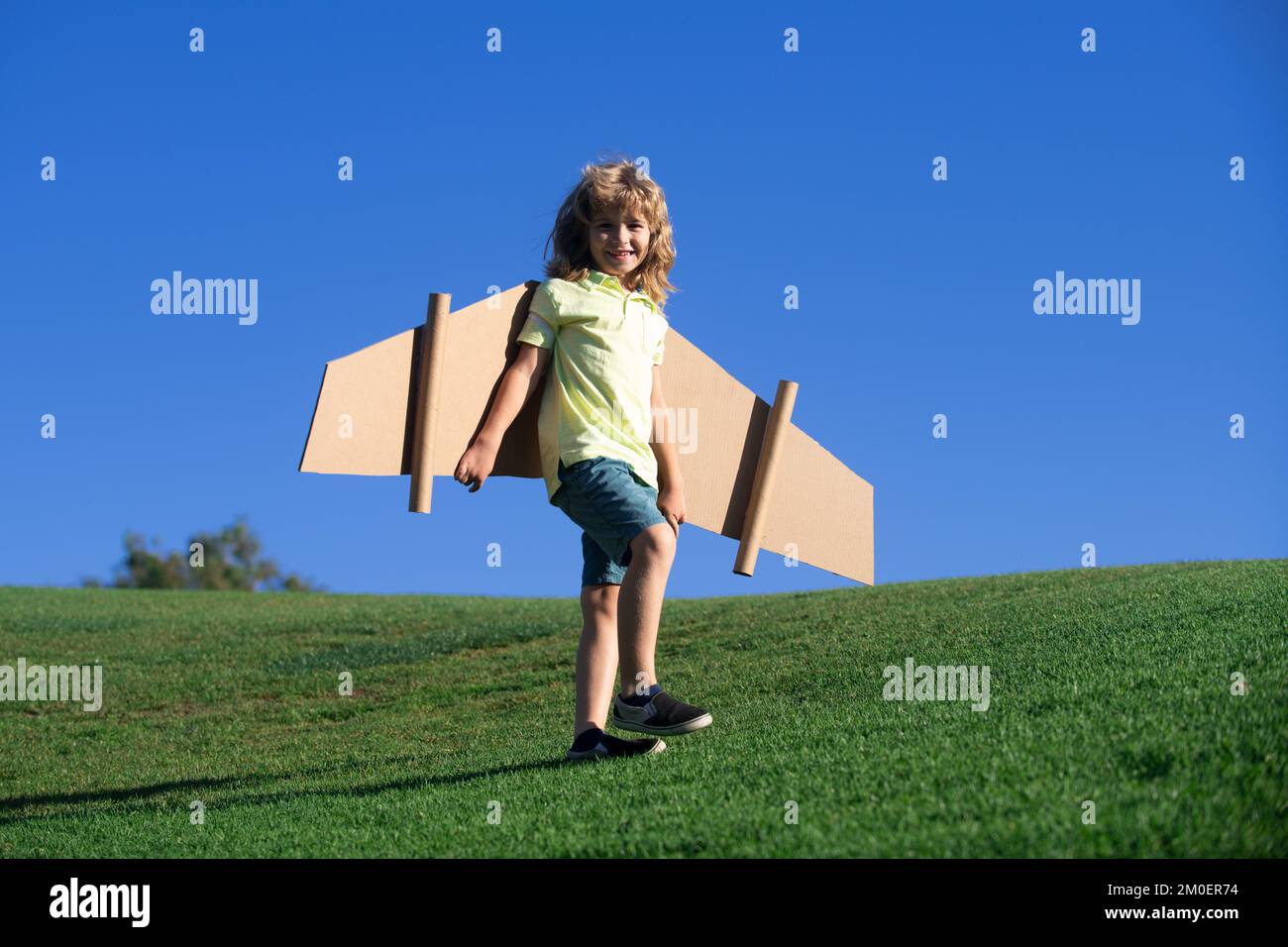 Child boy playing pilot on the sky blue background. Kid dreaming. Child ...