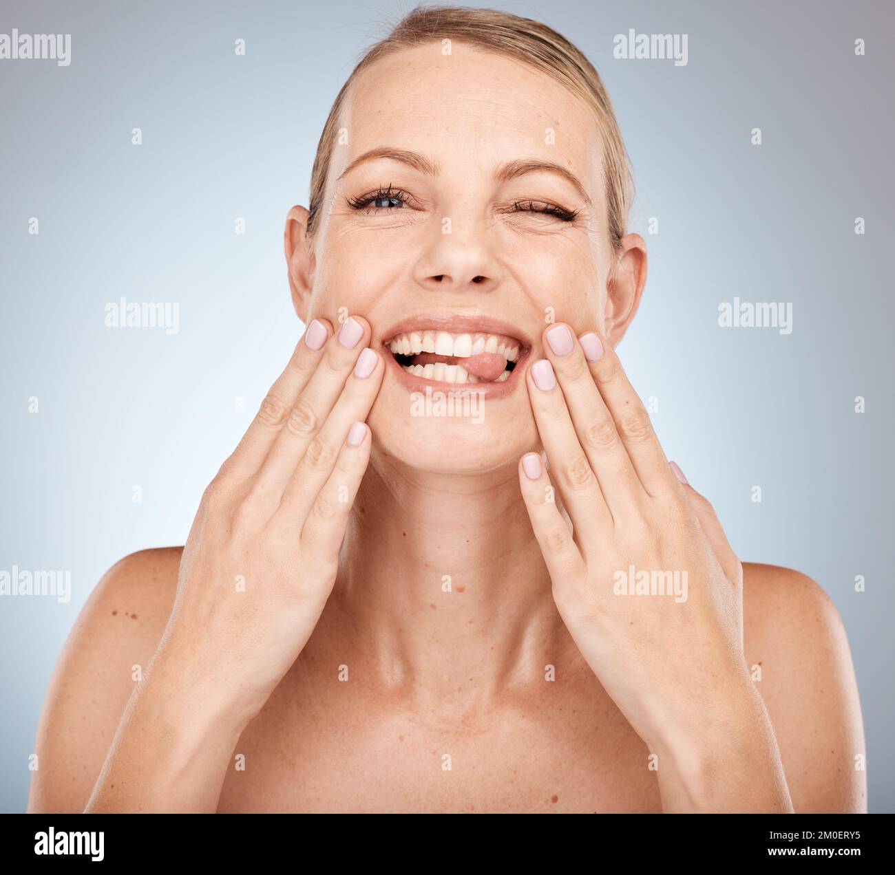 Face, skincare and beauty with a model woman in studio on a gray ...