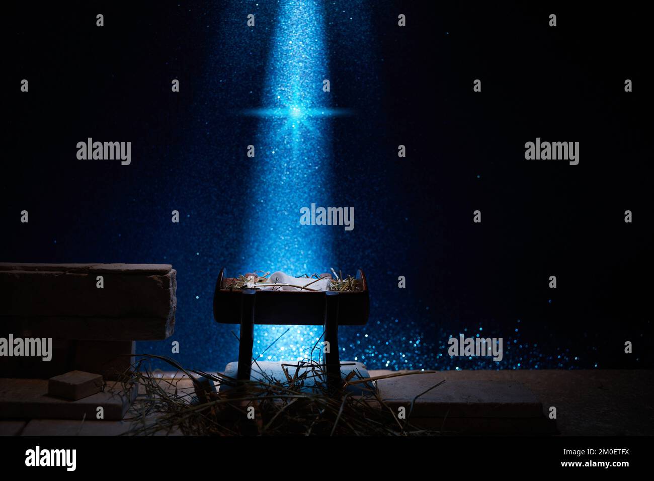 Nativity of Jesus, empty manger at night with bright lights Stock Photo ...