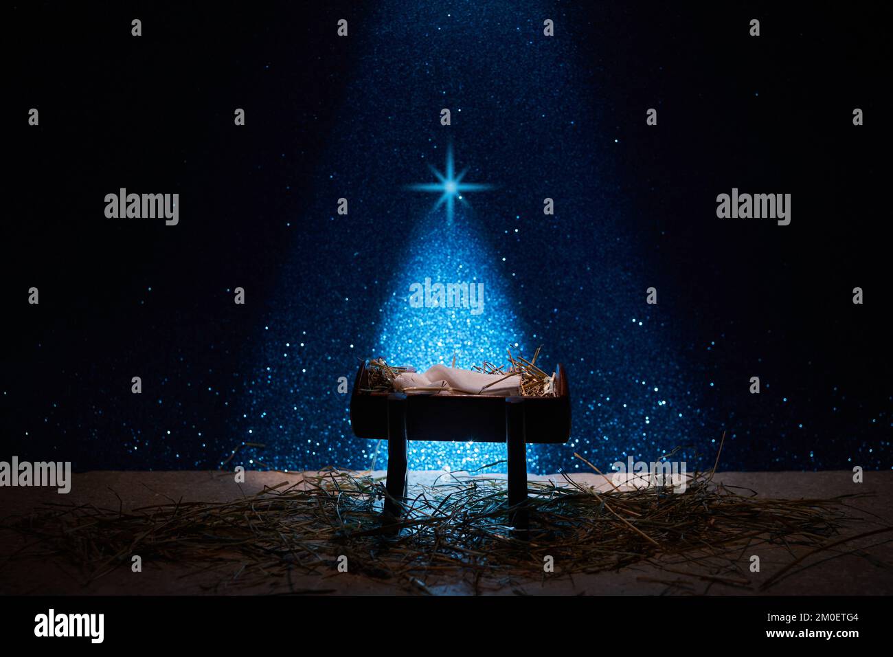 Nativity of Jesus, empty manger at night with bright lights Stock Photo ...
