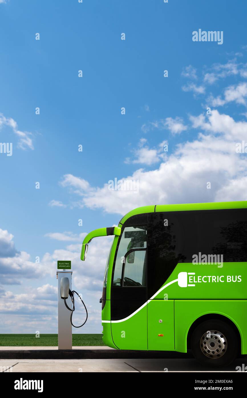 Electric city bus with charging station on a background of cityscape ...