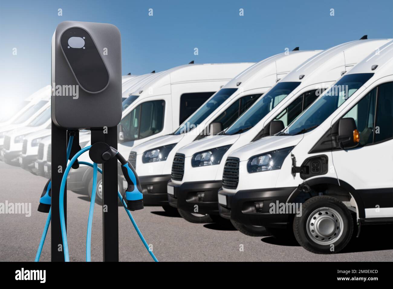Electric vehicles charging station on a background of a van. Concept ...