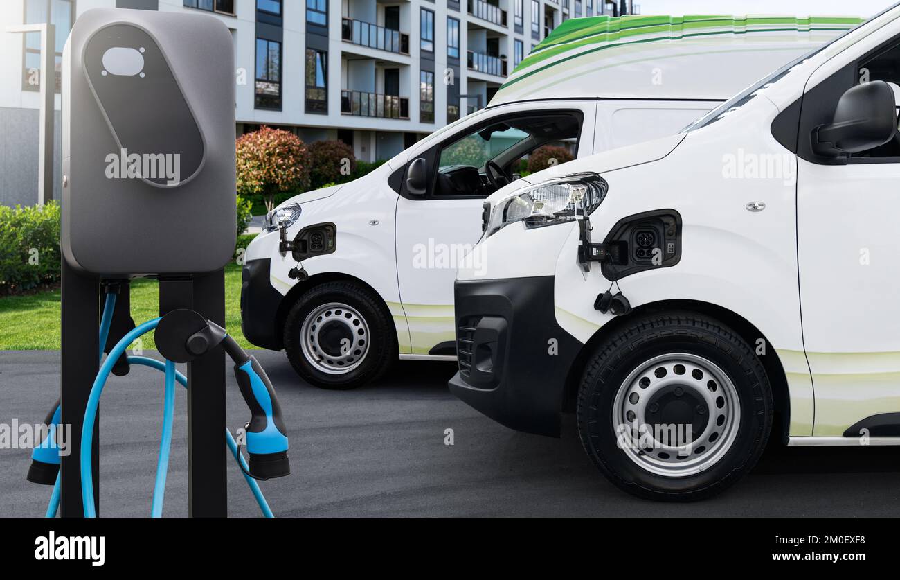 Electric vehicles charging station on a background of a van. Concept ...
